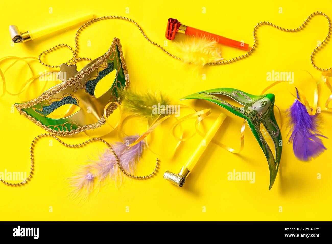 Carnival masks with party horns and decor for Mardi Gras celebration on ...