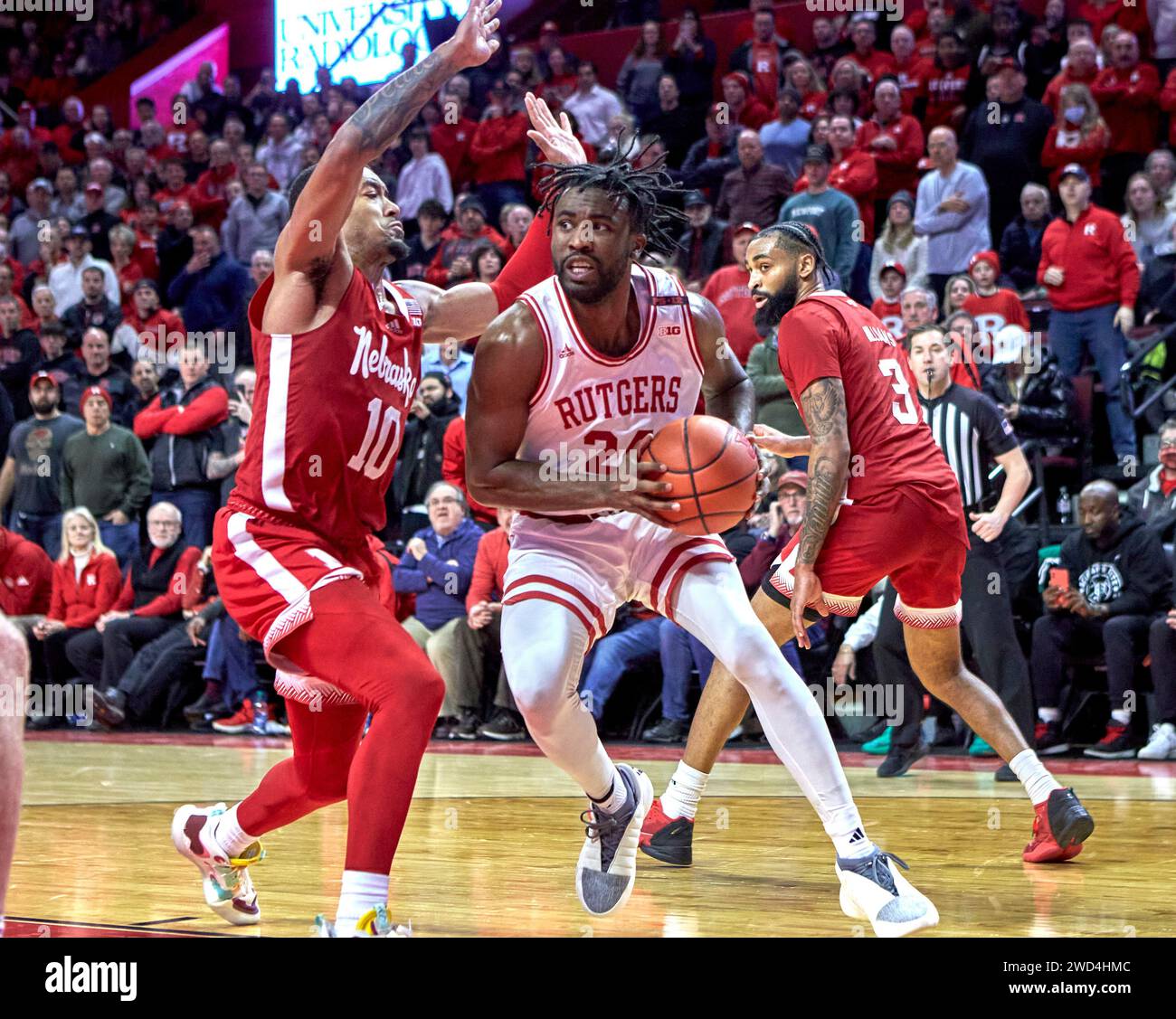 Rutgers Scarlet Knights guard Austin Williams (24) drives to the basket as Nebraska Cornhuskers ...