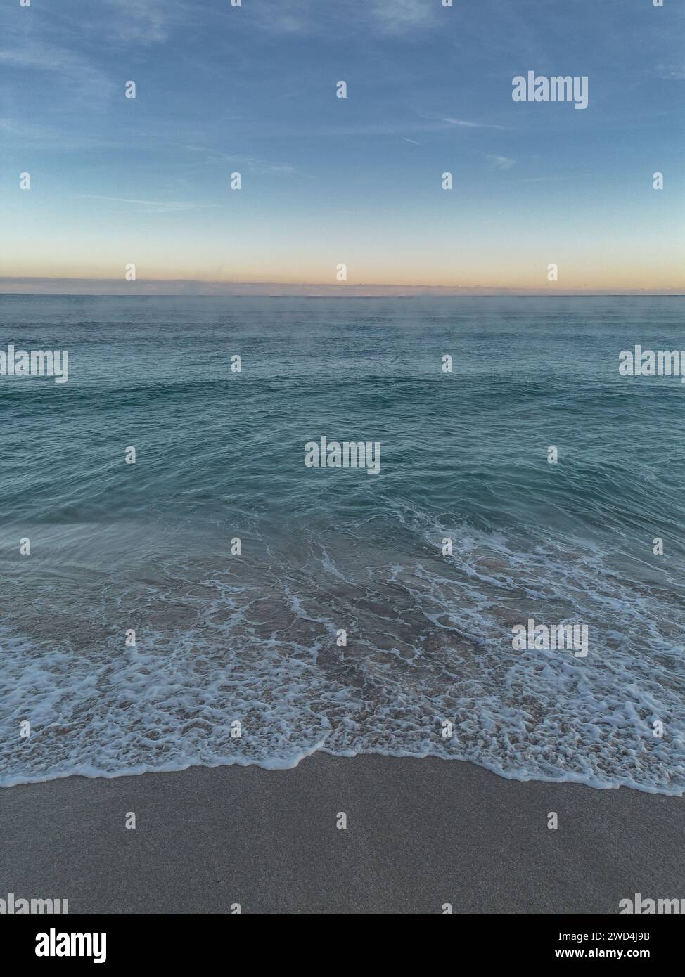 Beach shore wave background with the sunrise on the horizon Stock Photo ...