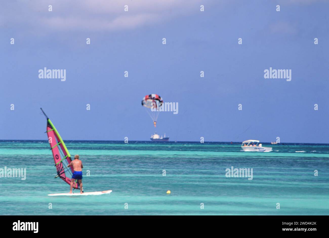 Windsurfing, boarding and parasailing are poplular off Palm Beach in ...