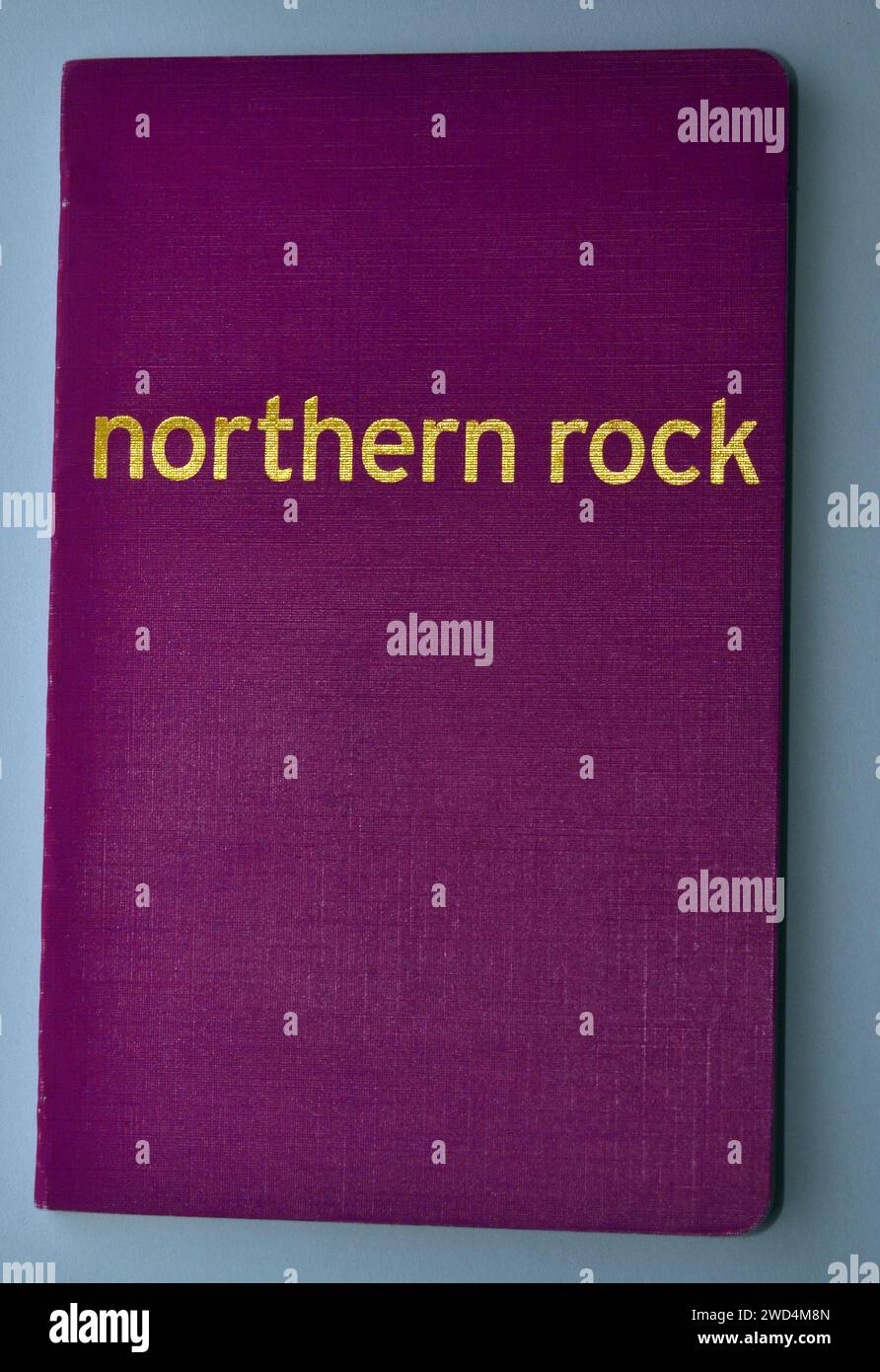 Cover of a Northern Rock bank savings book, gold text on a purple cover ...