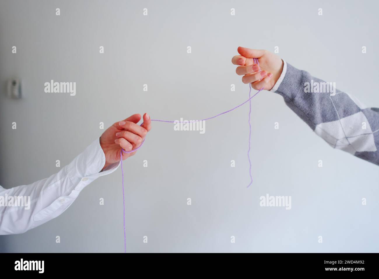 two hands pulling a rope. Rescue, help, helping gesture or hands. Conflict tug of war Stock ...