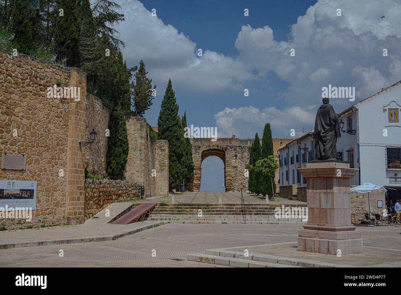 Stone statue on brick platform next to wall, Antequera, Spain Stock ...
