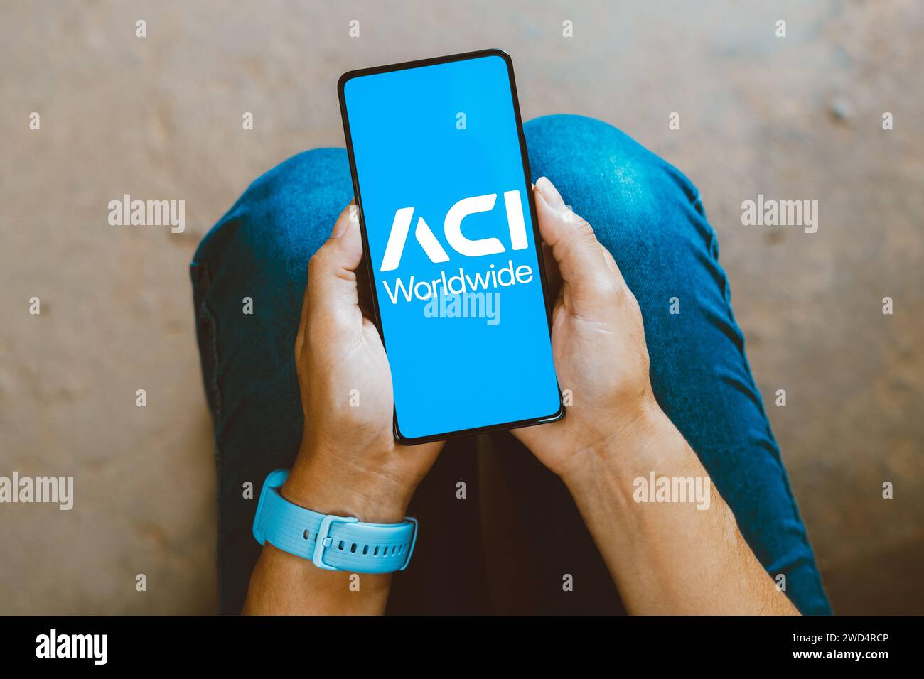In this photo illustration, the ACI Worldwide logo is displayed on a ...