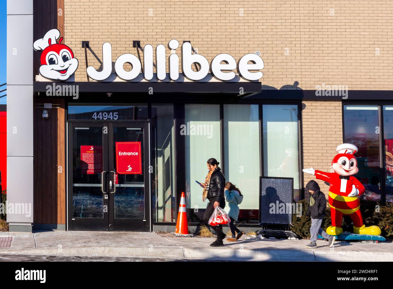 Sterling Heights, Michigan - Workers serve up Chickenjoy fried chicken ...