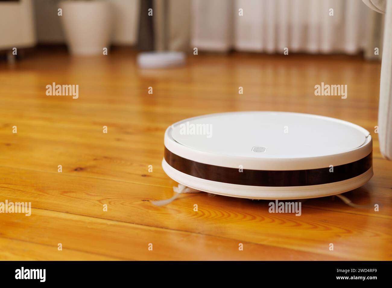 Robot vacuum cleaner and furniture hi-res stock photography and images ...
