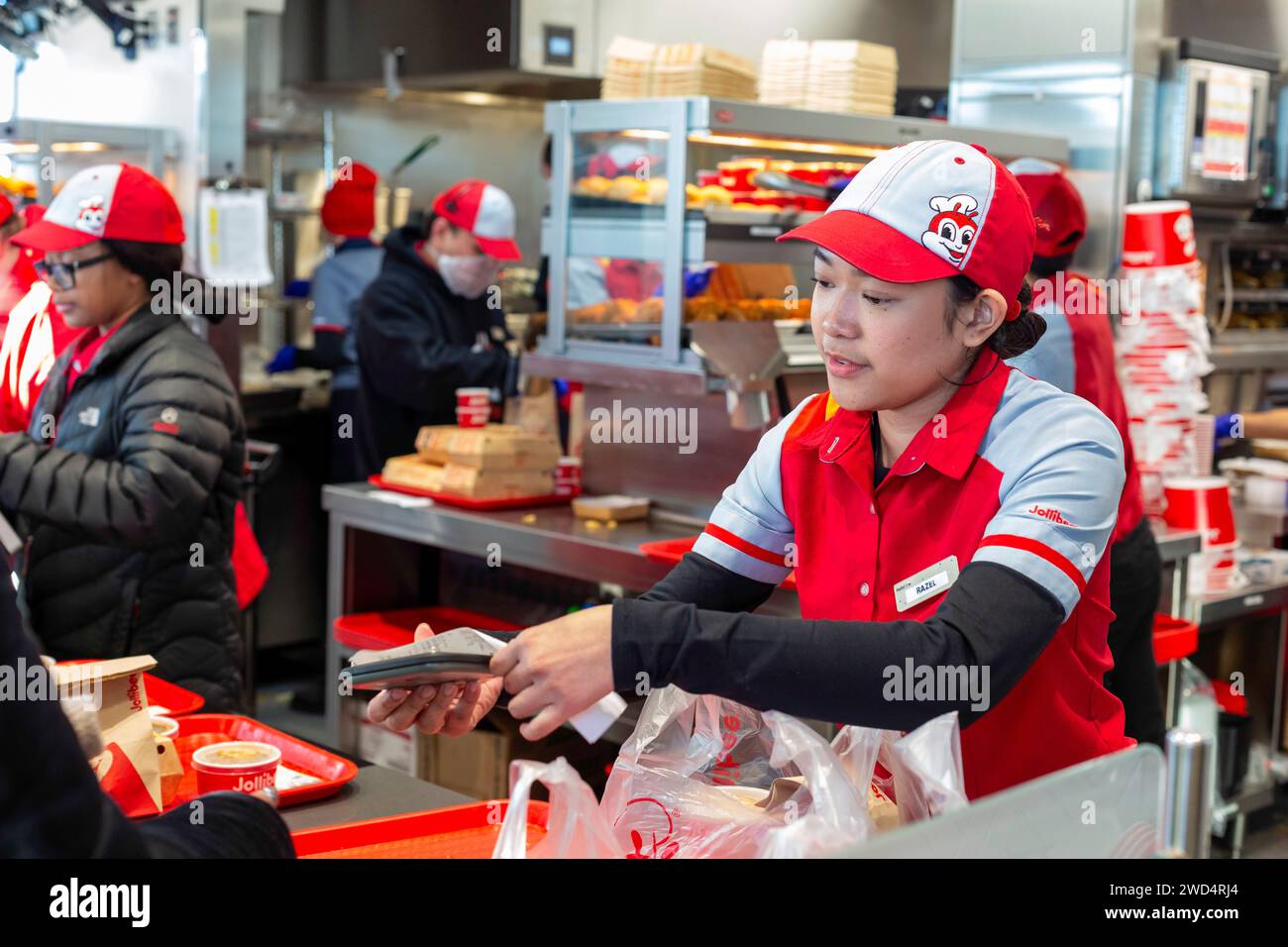 Sterling Heights, Michigan - Workers serve up Chickenjoy fried chicken ...