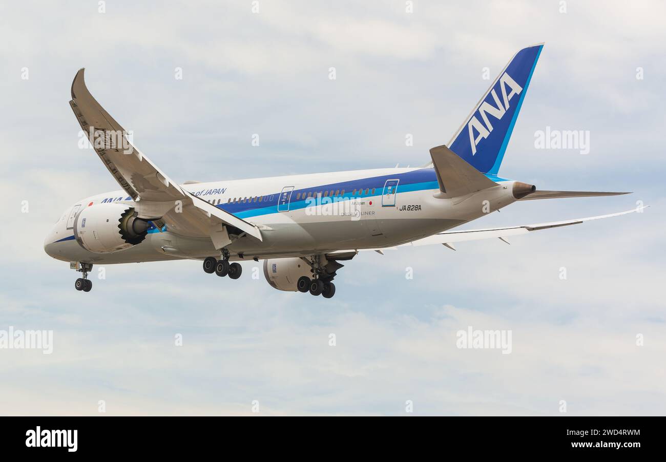 Aerial view of a commercial jet flying high above the fluffy white ...