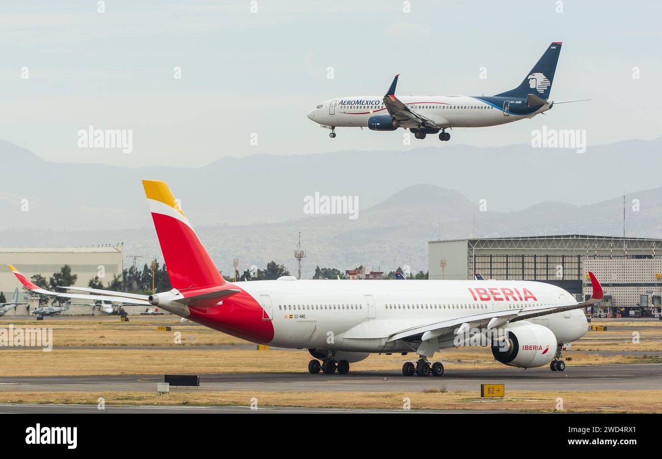 A commercial aircraft departing from an airport runway, with a second ...