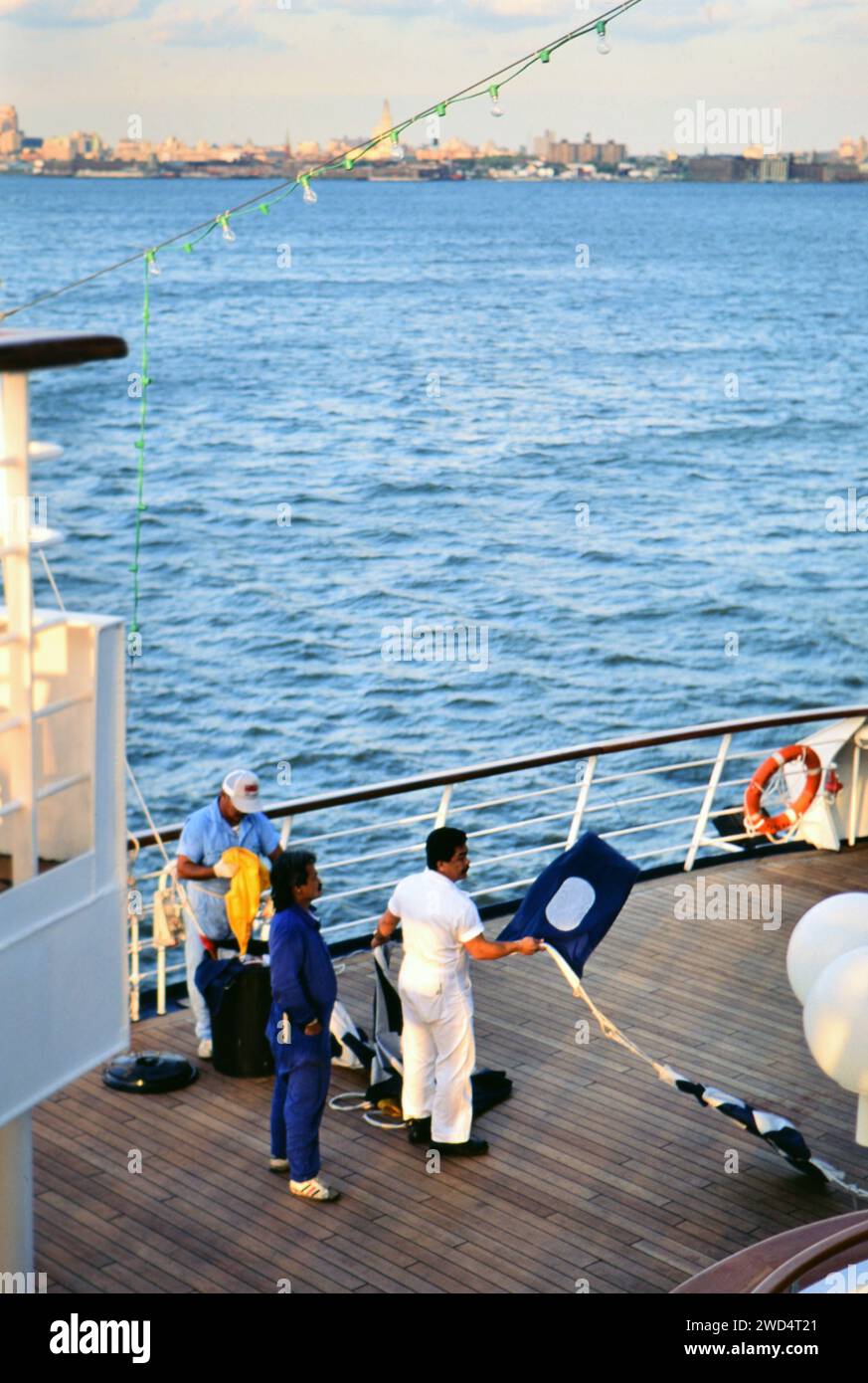 Workers on a Crown Cruise Lines ship, leaving Manhattan ca. 1998 ...