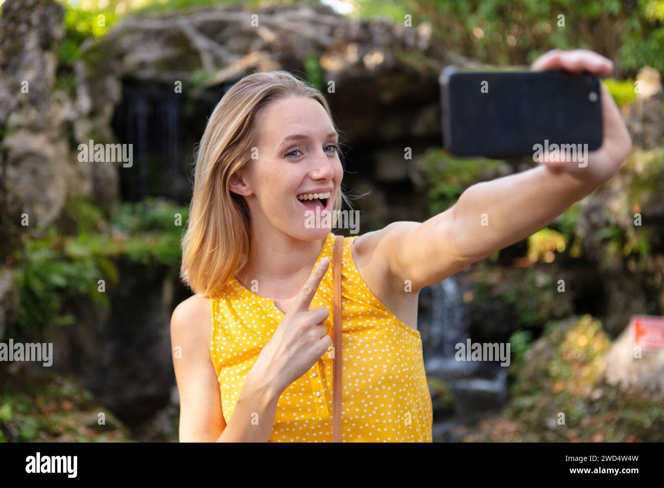 girl take selfie on phone at beautiful caves Stock Photo - Alamy