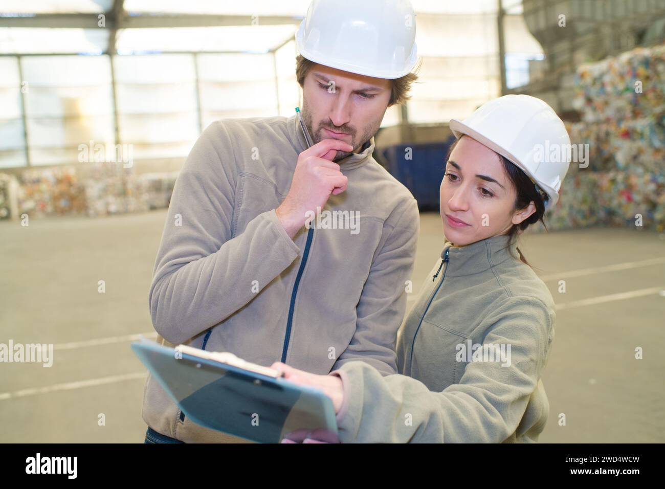 young male and female factory workers Stock Photo - Alamy
