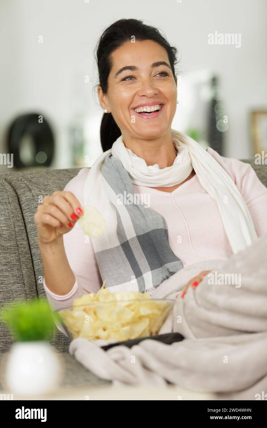 Woman watching movie eating sweet hi-res stock photography and images ...