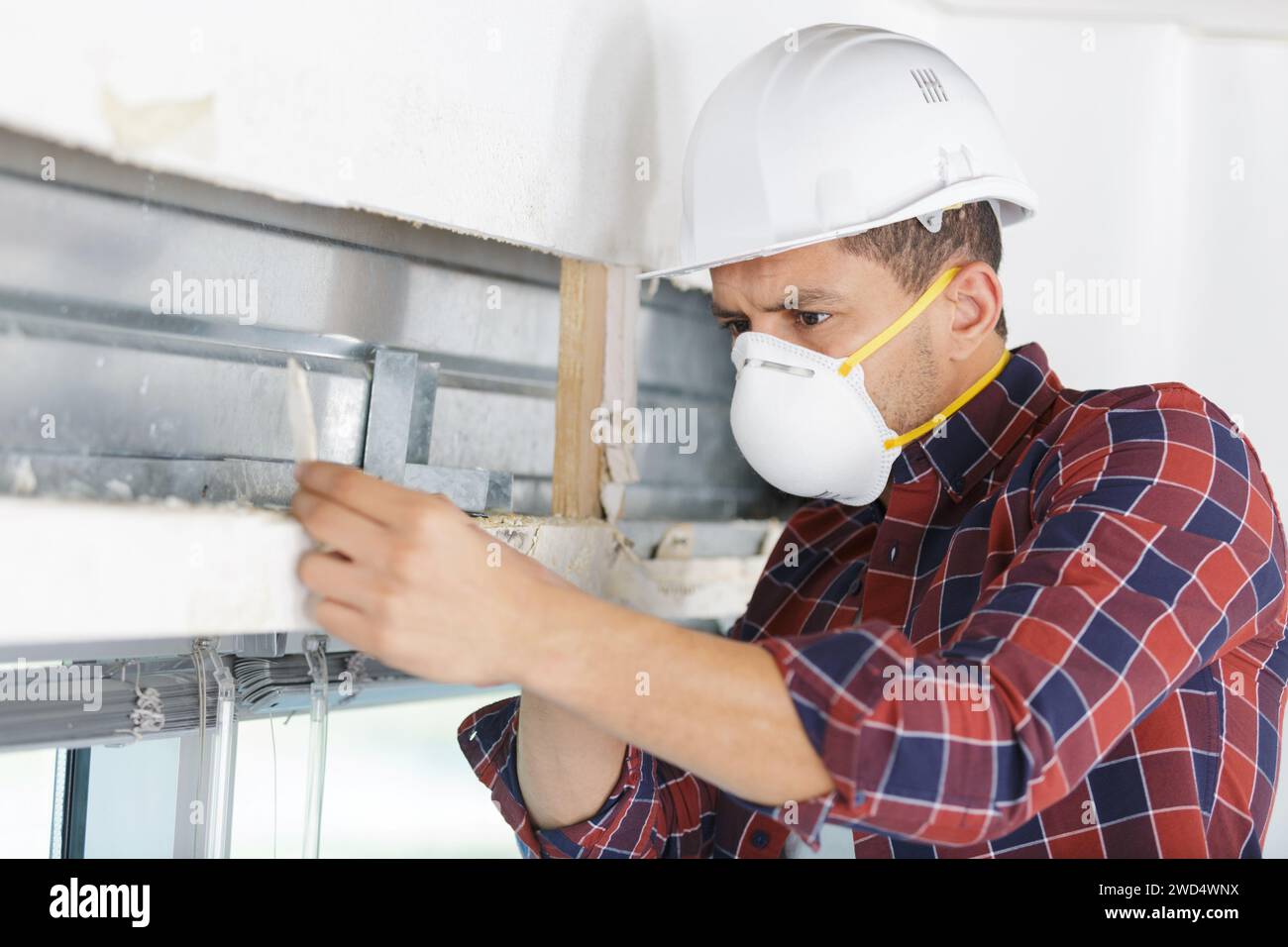 attractive and confident constructor builder working at construction ...