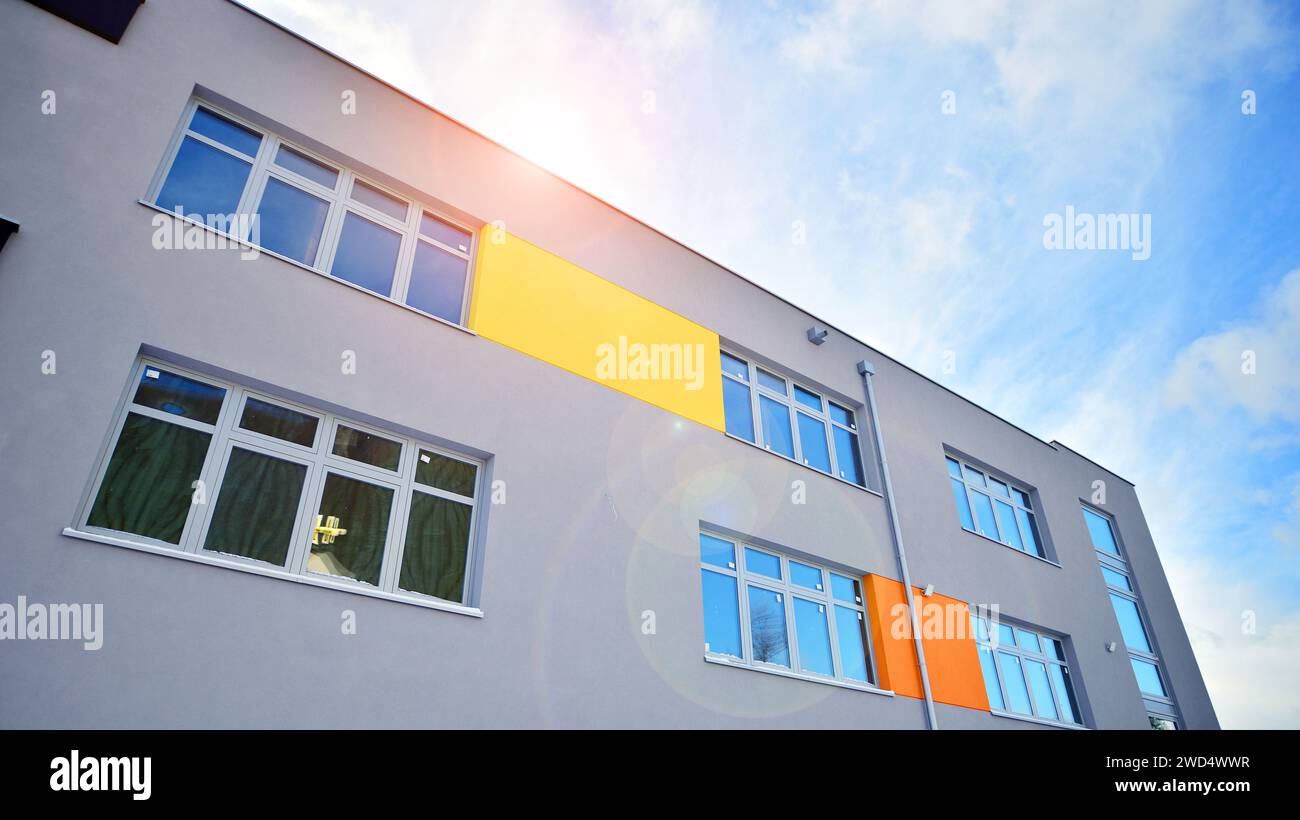 Multi-colored facades of the school with white window frames Stock ...