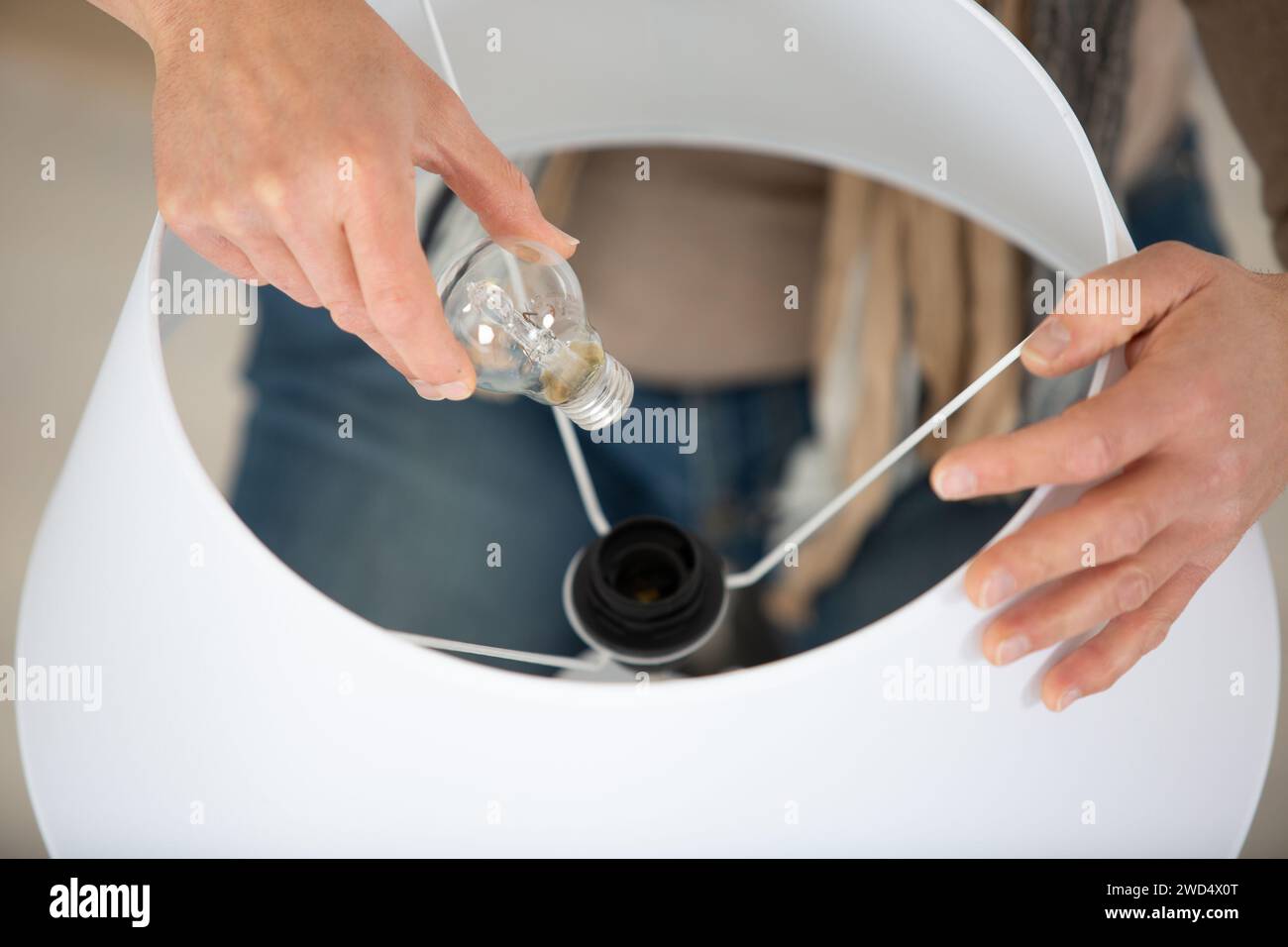 hand turns the switch on a lamp Stock Photo - Alamy