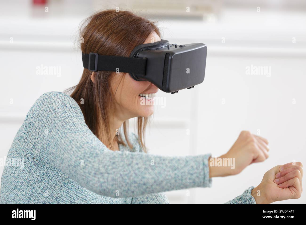 young woman using driving simulator Stock Photo - Alamy
