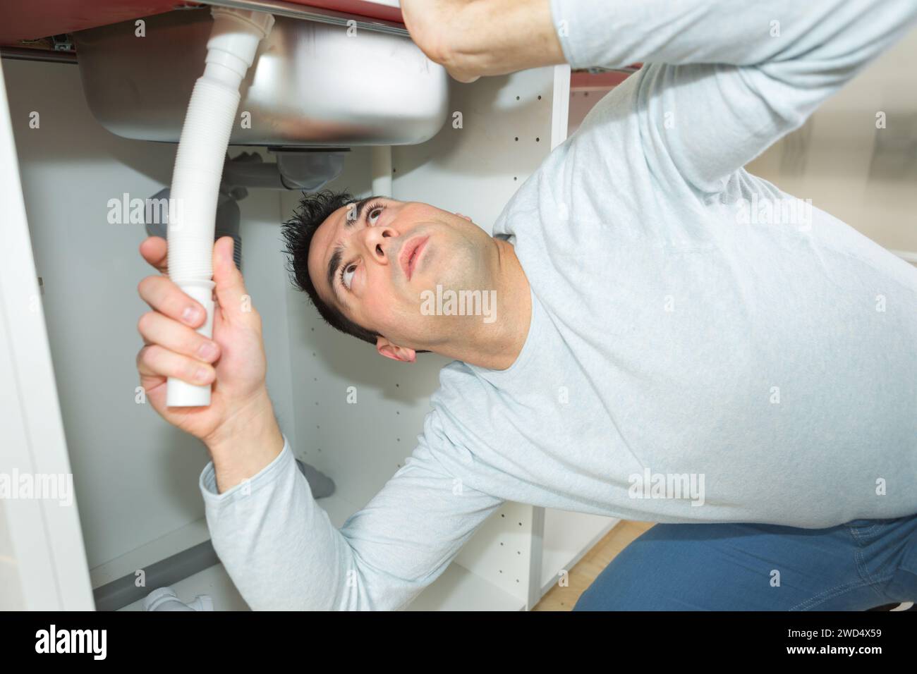 Fixing leaking pipes hi-res stock photography and images - Alamy