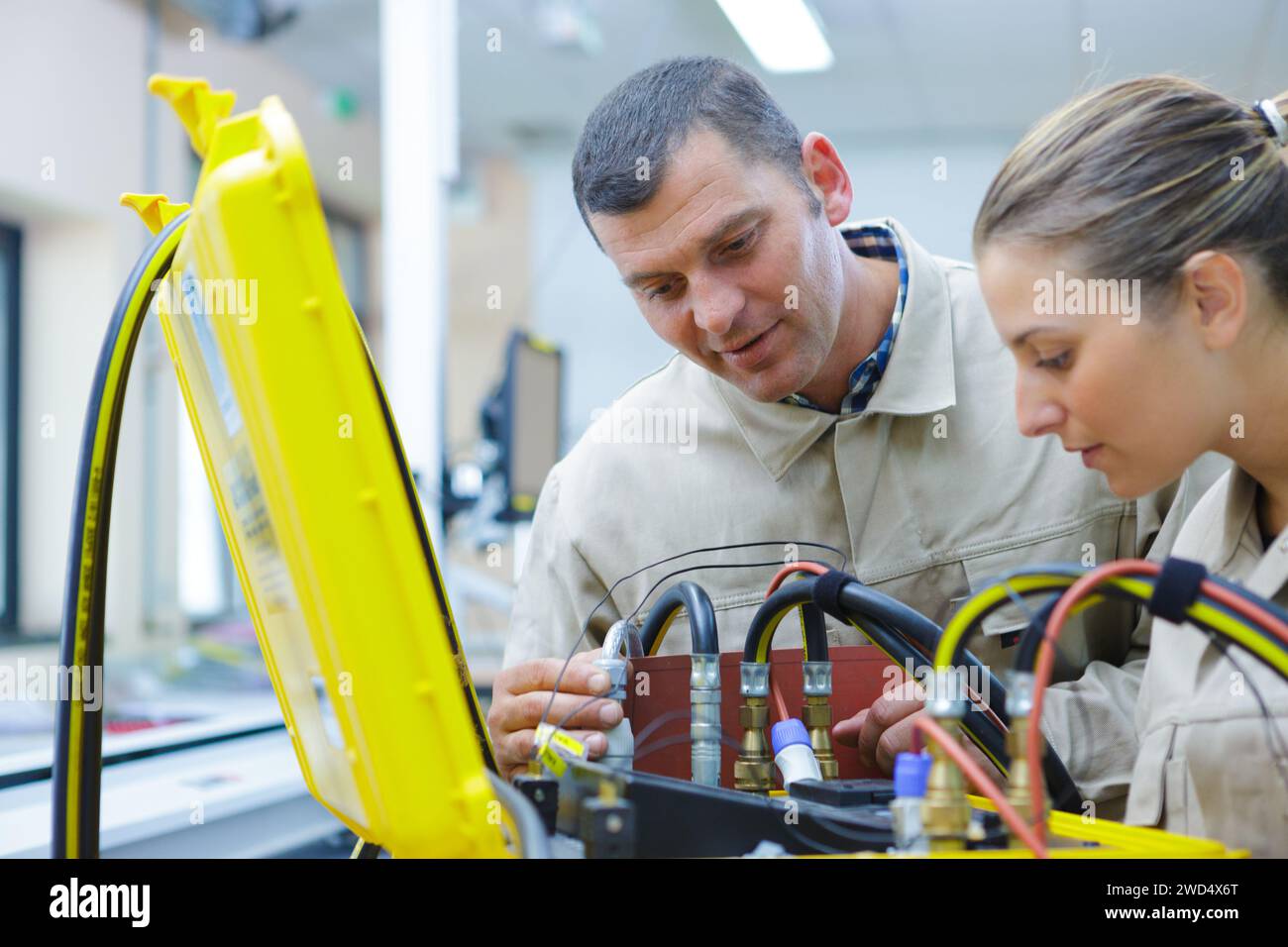 aircraft maintenance technician checking mechanical parts Stock Photo ...