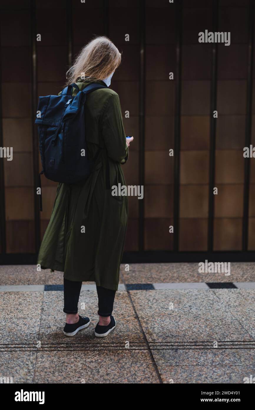 Seen from behind modern female hi-res stock photography and images - Alamy