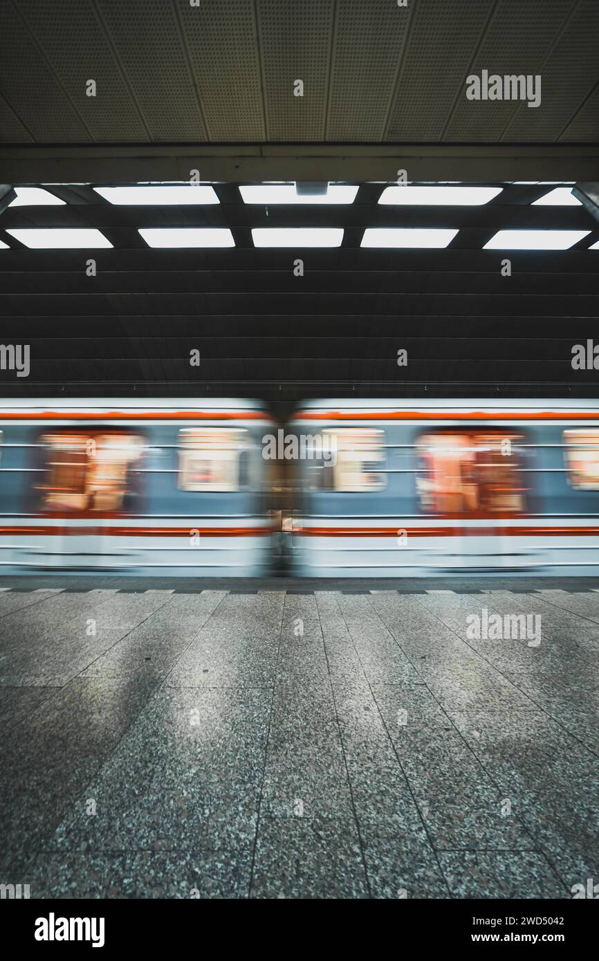 metro train passing station in fast movement Stock Photo - Alamy