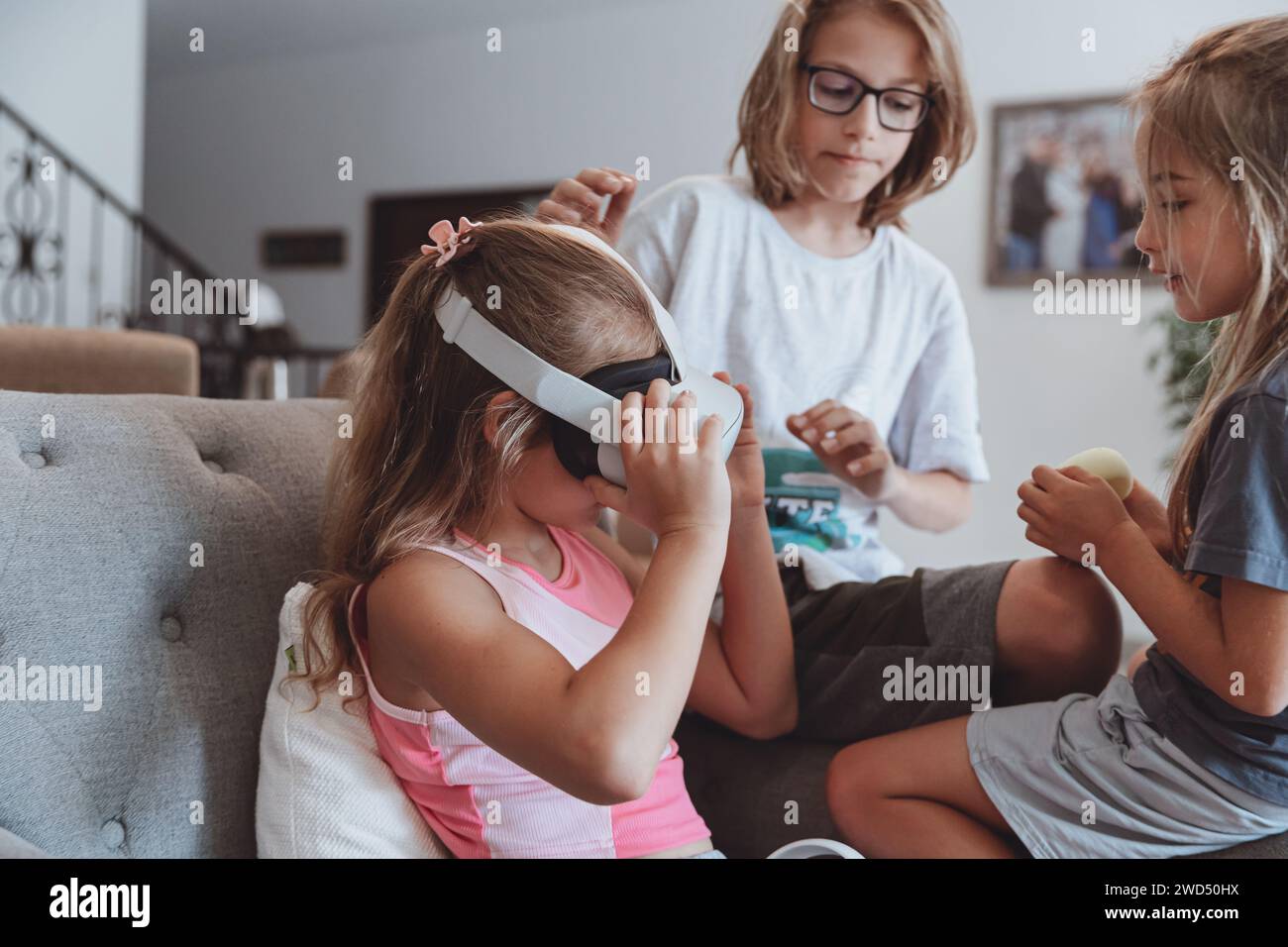 Happy Siblings Playing Video Games Stock Photo - Alamy