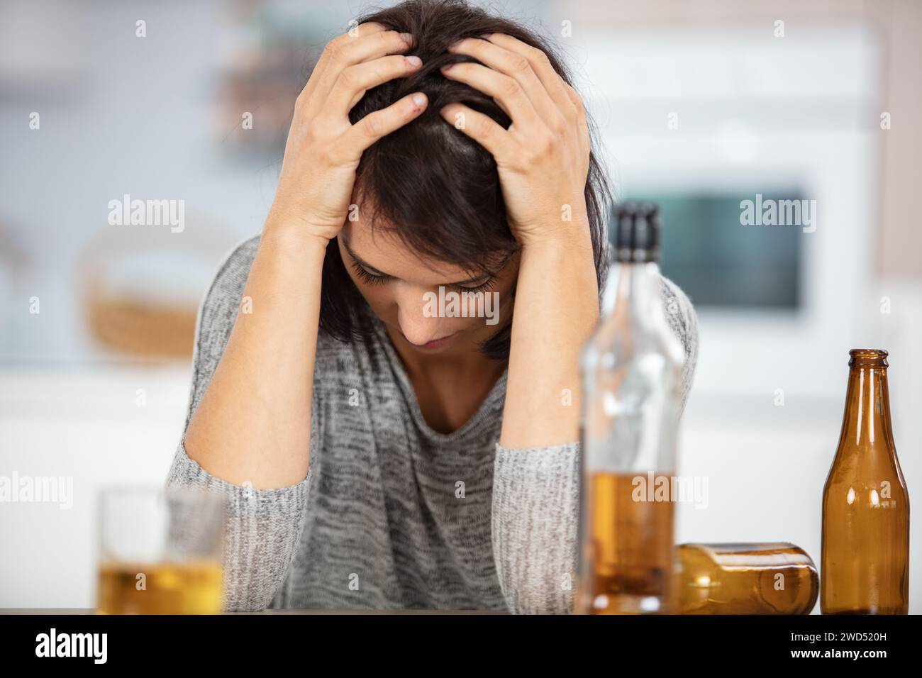 sad and wasted alcoholic woman Stock Photo - Alamy