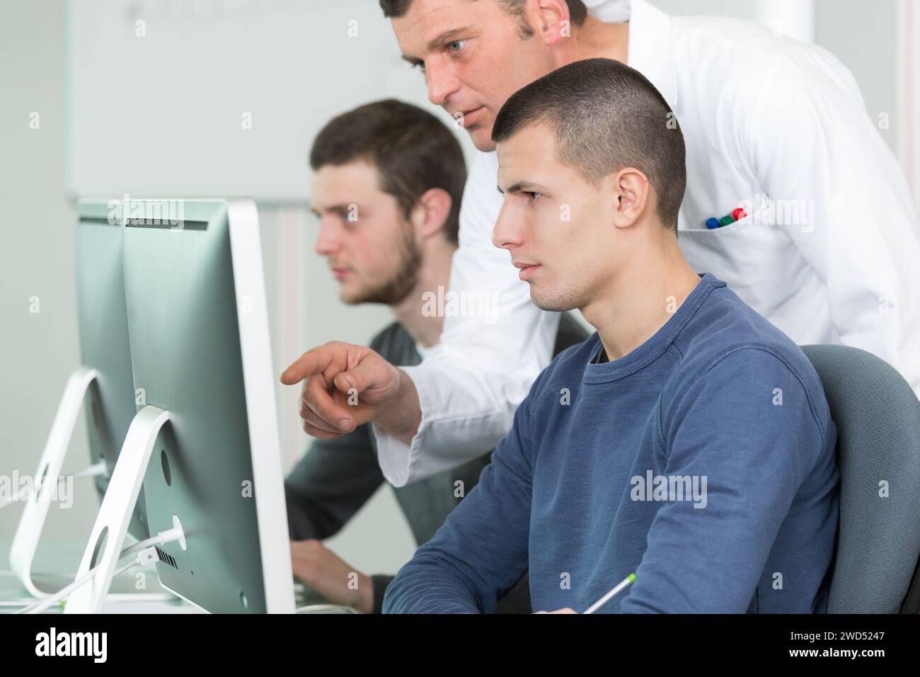 young men in the computer laboratory Stock Photo - Alamy