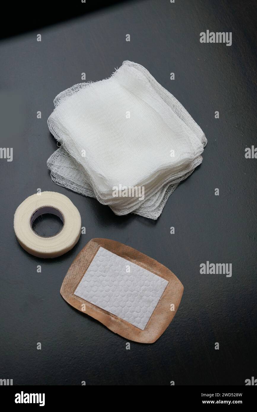 White bandages, fabric, and a brown paper patch Stock Photo - Alamy