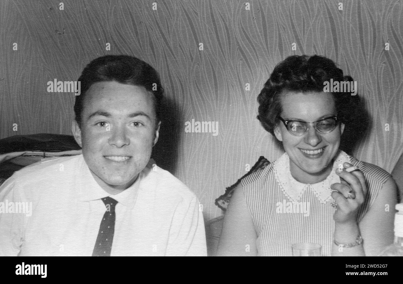 Hand holds cigarette Black and White Stock Photos & Images - Alamy