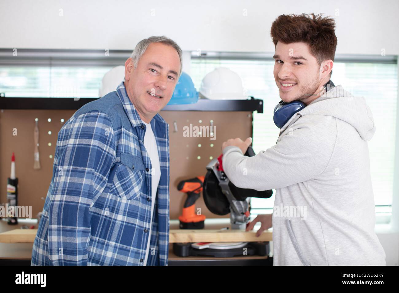 Two men drilling hole hi-res stock photography and images - Alamy