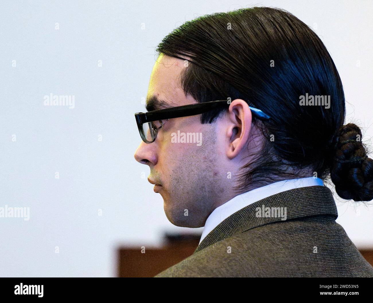 Defendant Marcus Eriz listens opening statements in his trial, Thursday ...
