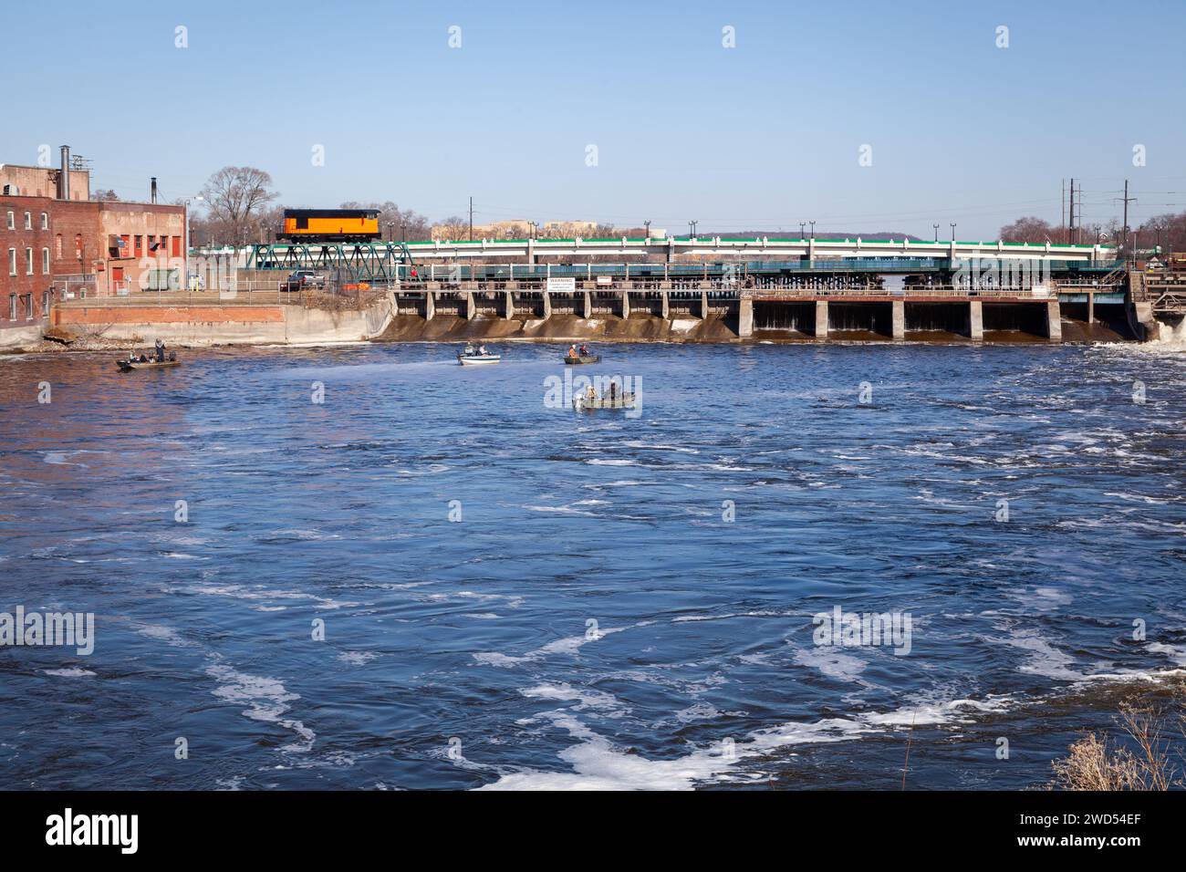 Fishermen near a hydro electric damn on the Rock River in Beloit ...