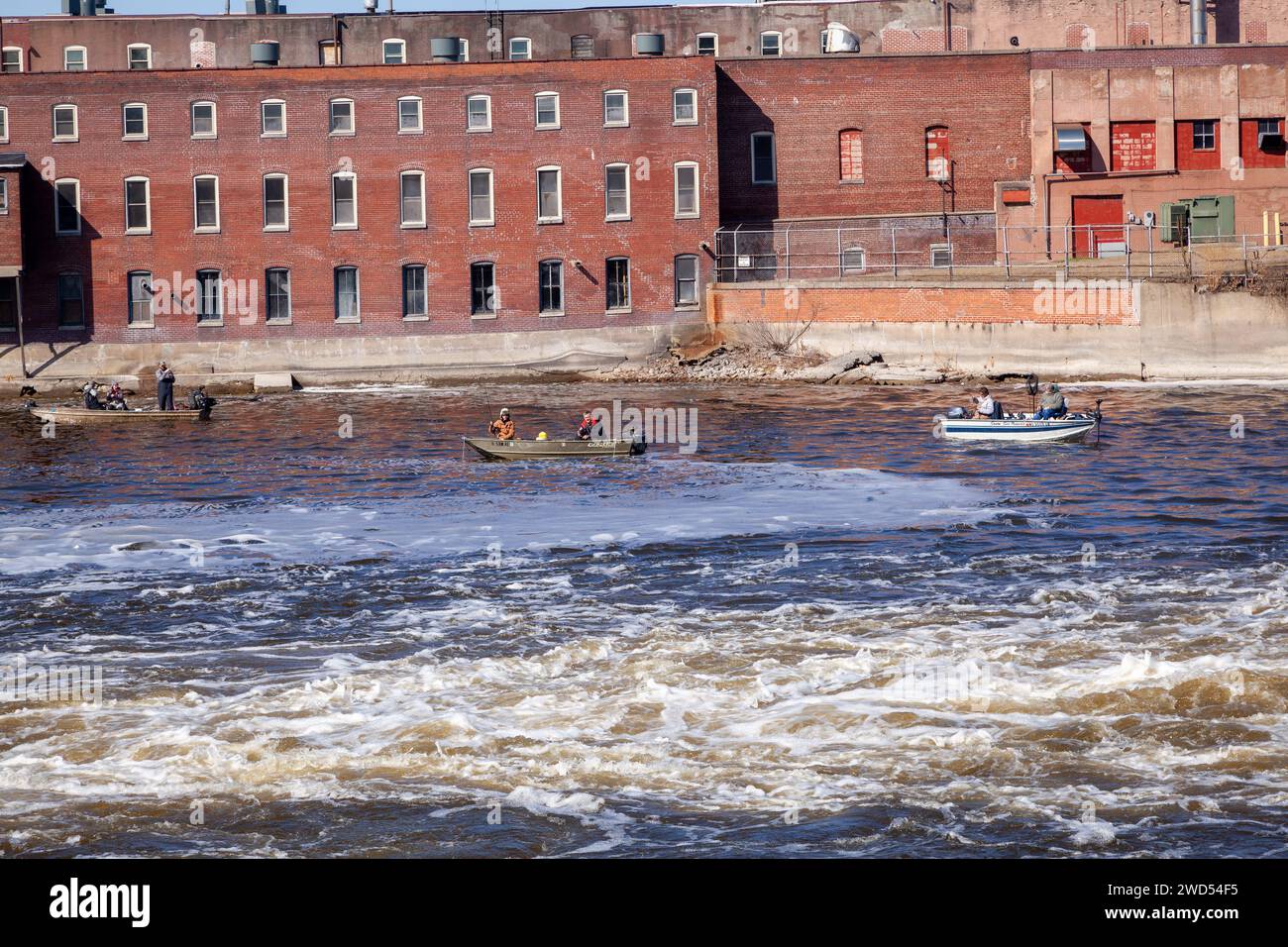 Fishermen near a hydro electric damn on the Rock River in Beloit ...
