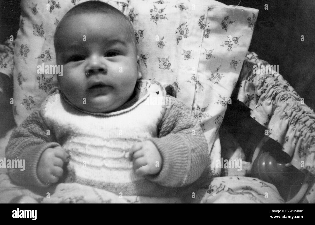 An antique photo with shows portrait of a baby in a stroller. Germany ...