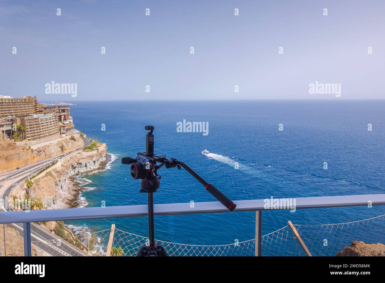 View of stable camera tripod set up on balcony of hotel overlooking ...