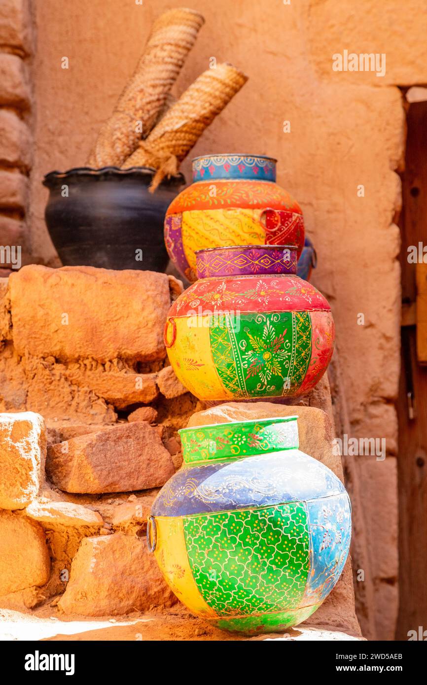 Three ornated traditional decorated arabic jars standing on street of ...