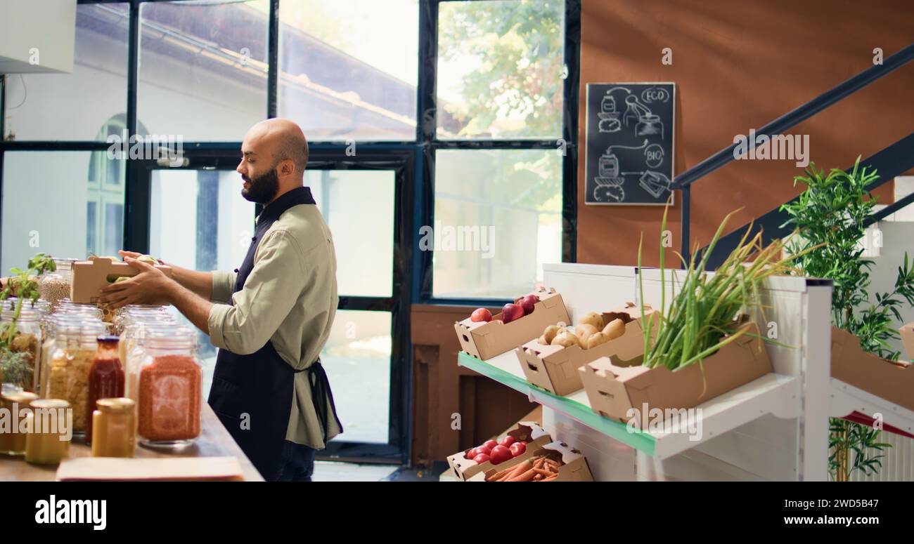 Couple supporting local merchant by buying eco freshly harvested fruits ...