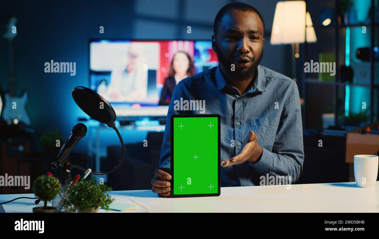 Tech content creator filming green screen tablet unboxing, giving ...