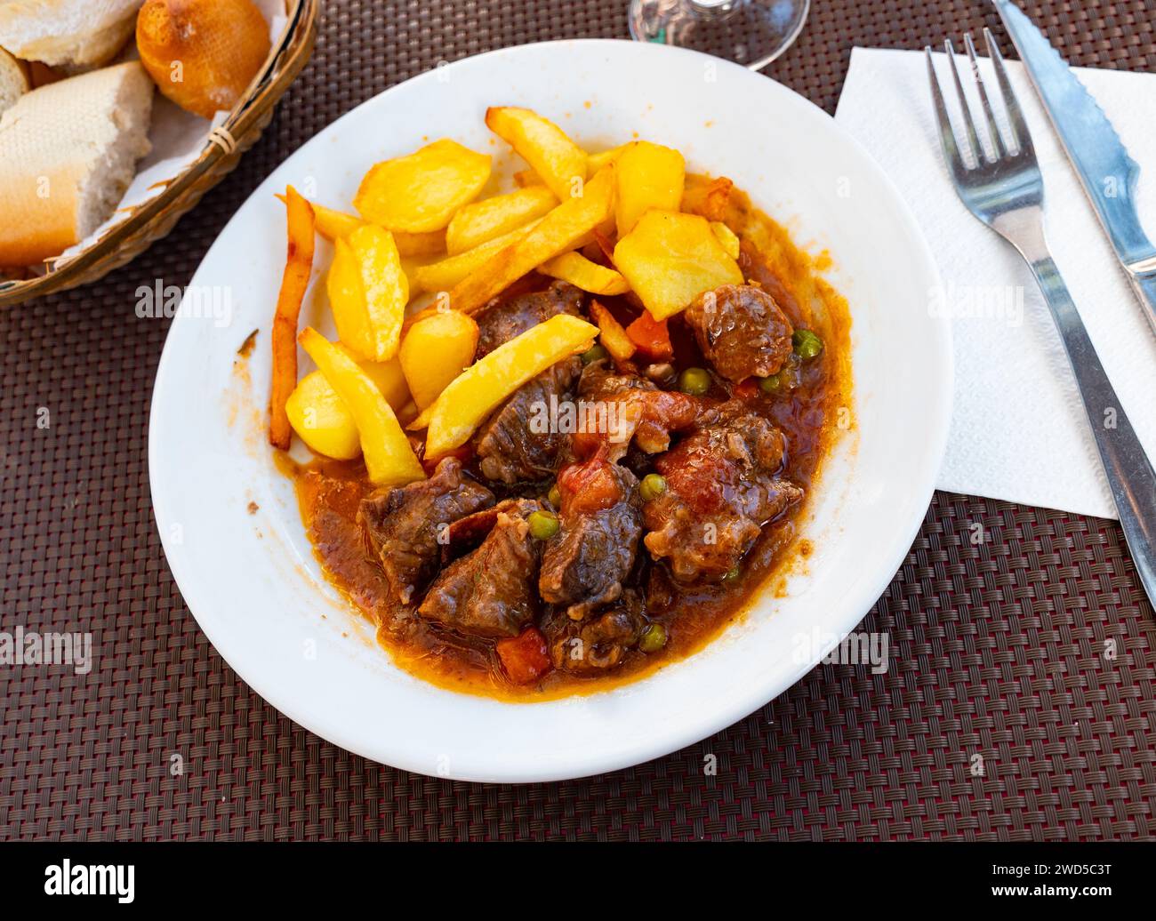 Beef stew served with stewed vegetables Stock Photo - Alamy