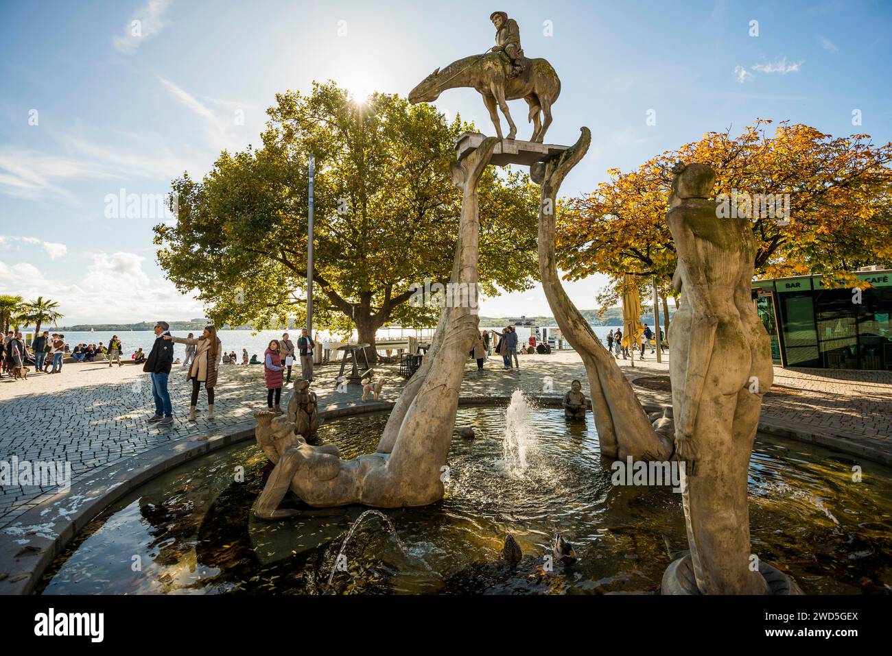 Fountain and lakeside promenade, the Lake Constance rider by Peter Lenk ...