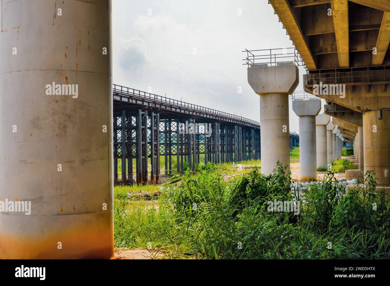 Landscape of iron substructure of bridge under construction over river ...