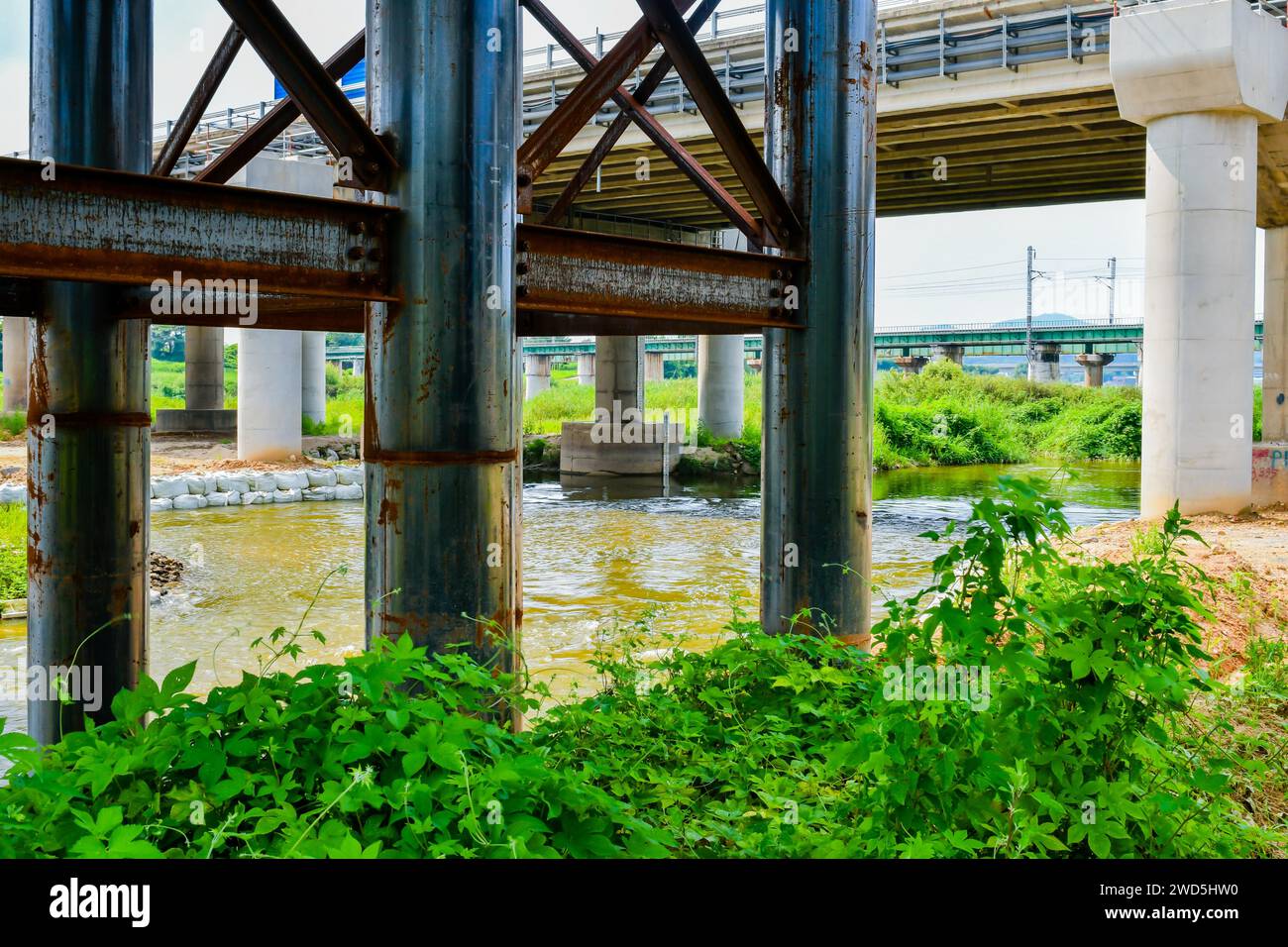 Lower portion of iron substructure of bridge under construction over ...