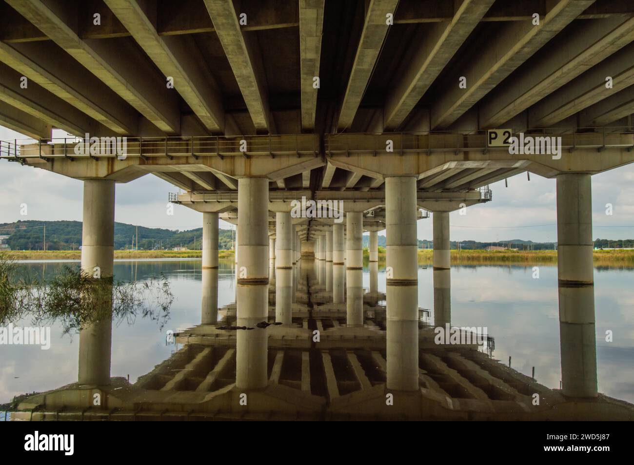 Perspective view of underside of bridge with the bridge reflection in ...