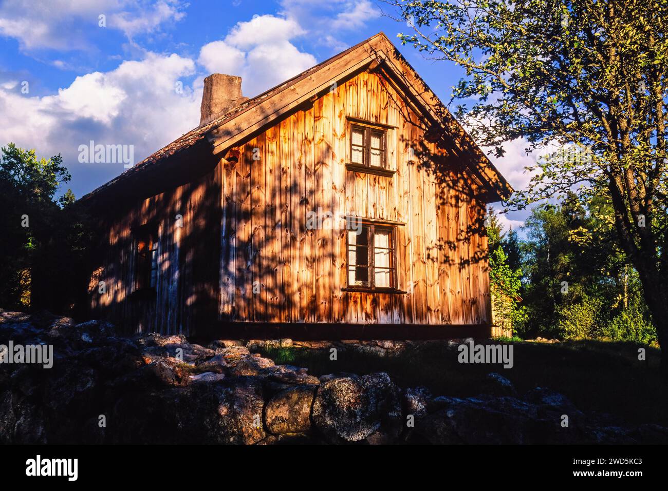 Old rural wooden cottage in the shade in the countryside, sweden Stock ...