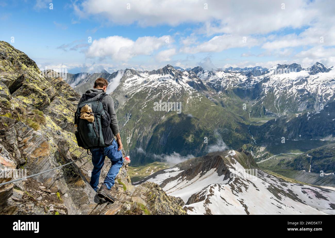 Mountaineers on a rope-insured hiking trail, breathtaking mountain ...