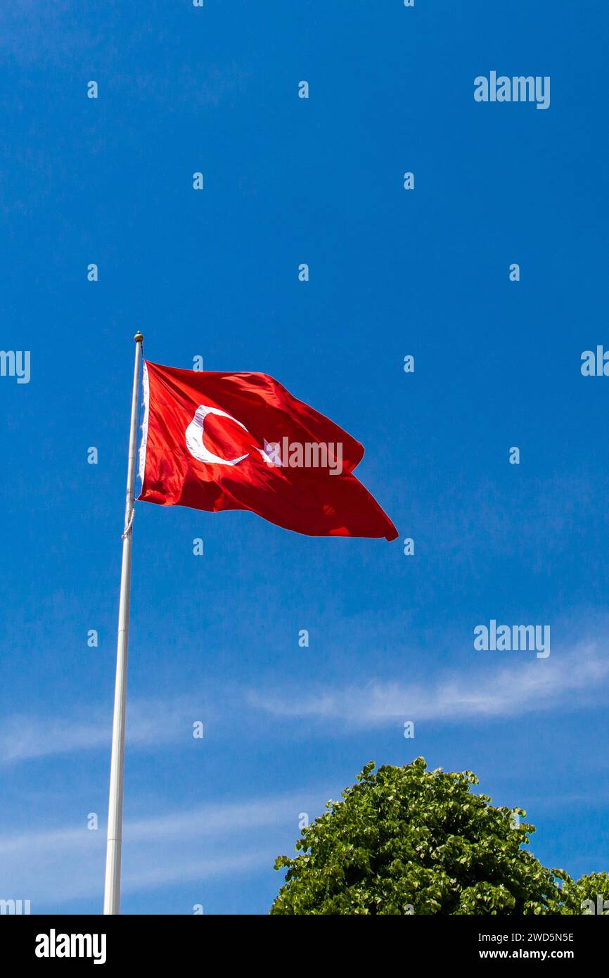Turkish national flag with white star and moon in sky Stock Photo - Alamy