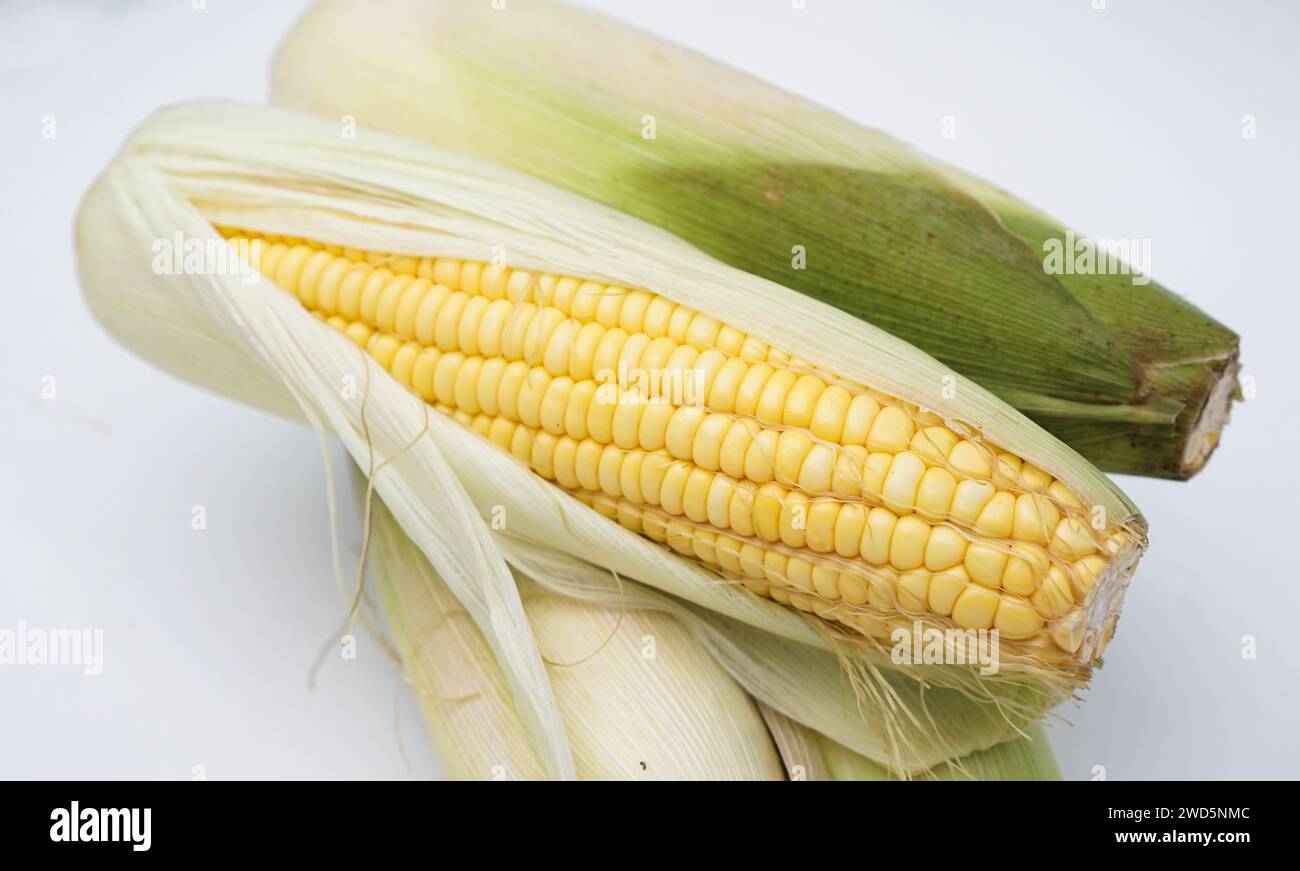 corn wrapped in leaves - 2 Stock Photo - Alamy
