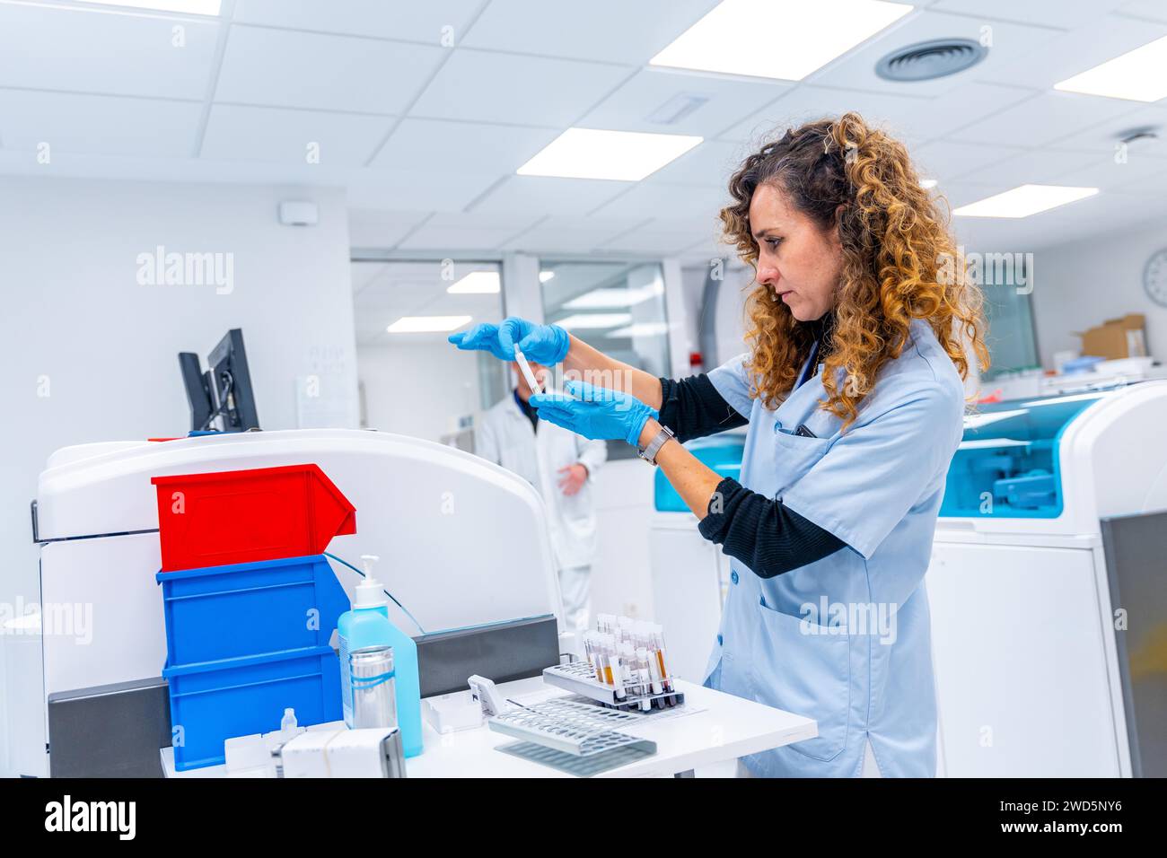 Female doctor working with samples in a modern laboratory in the ...