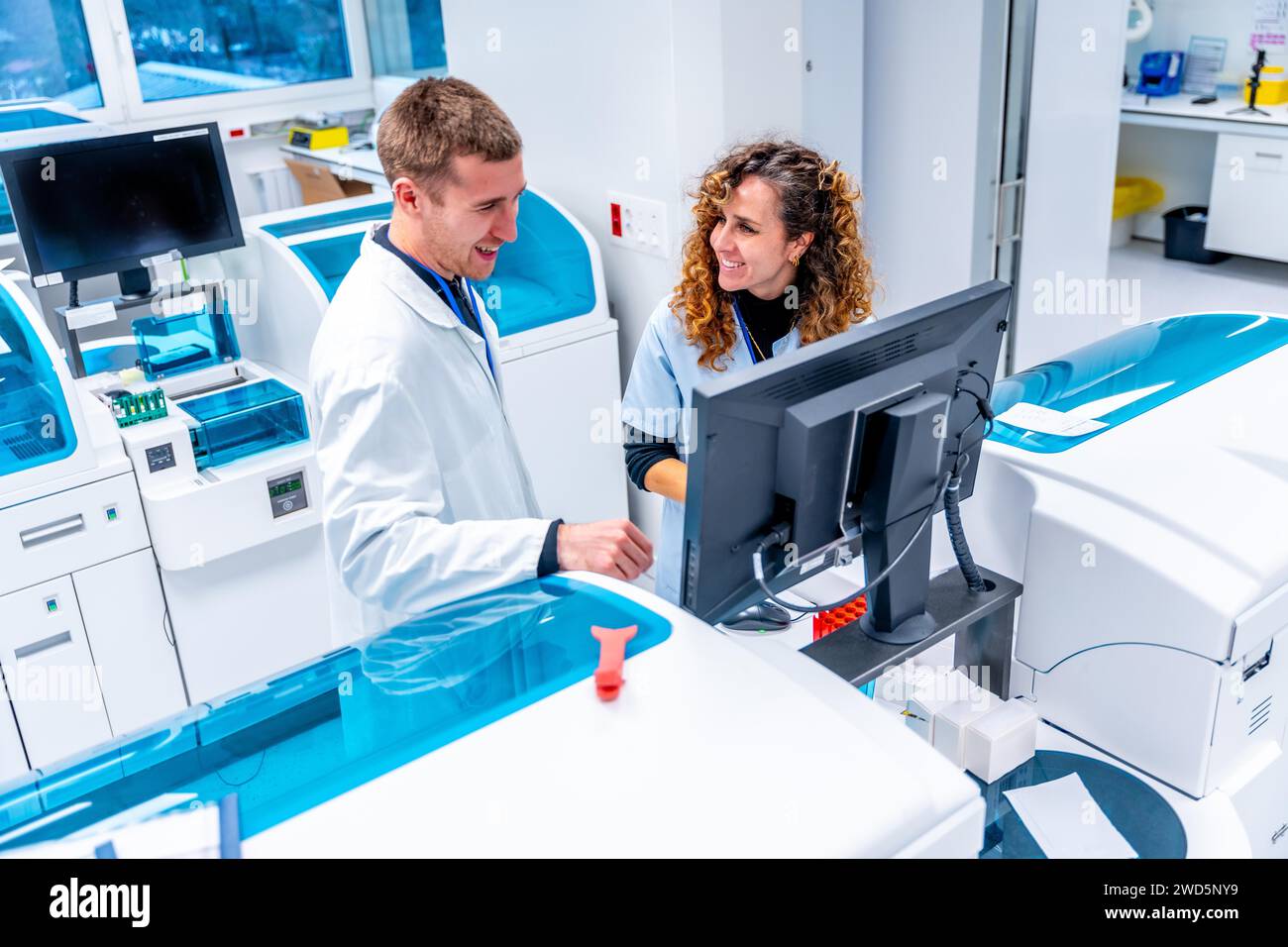 Top view of two doctors using computer working in a laboratory in the ...